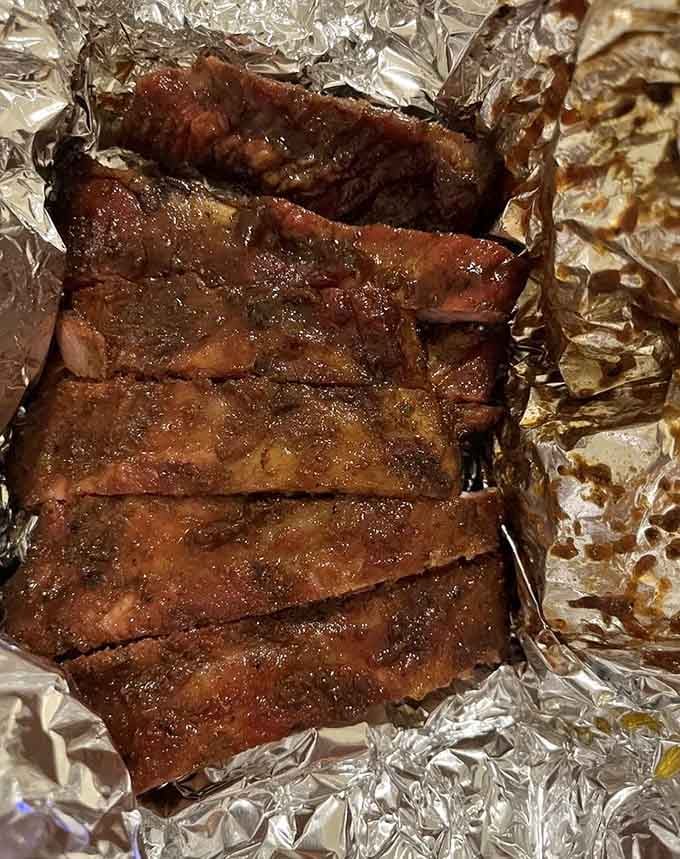 These ribs have that gorgeous bark and smoke ring that prove someone's been tending the smoker with love.