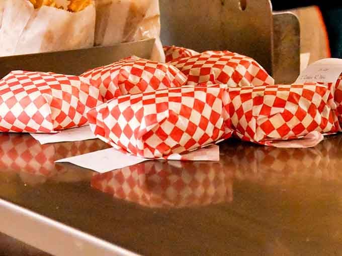 Those checkered wrappers mean business: classic drive-in burgers that don't need fancy plating to impress anyone.