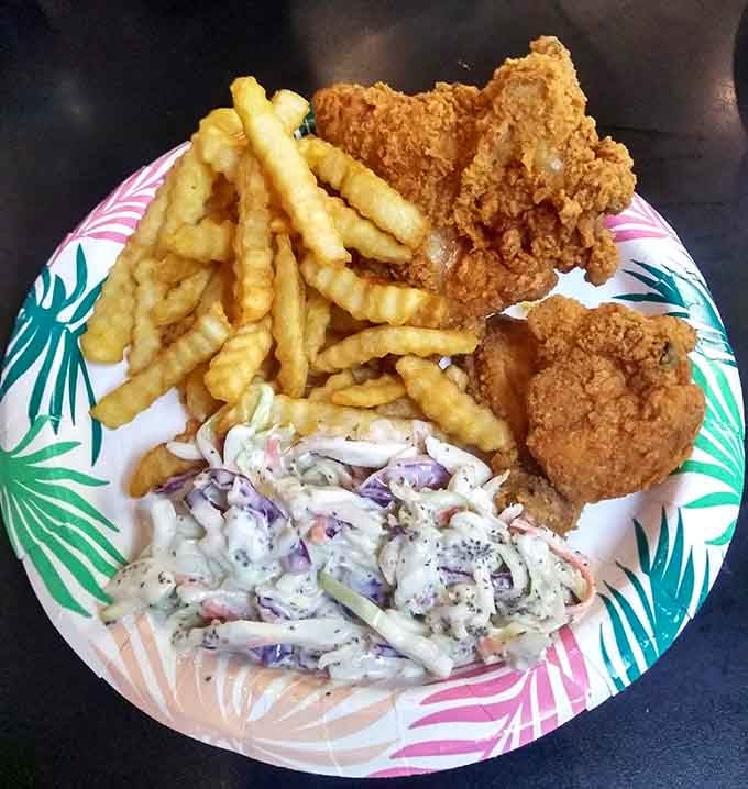Golden fried chicken with crinkle fries and creamy coleslaw: the holy trinity of comfort food done absolutely right.