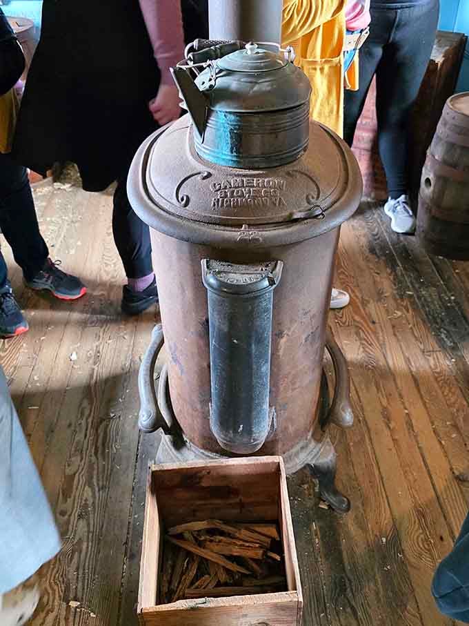 That vintage parlor stove was the social hub where community gathered, gossip flowed, and history quietly unfolded.