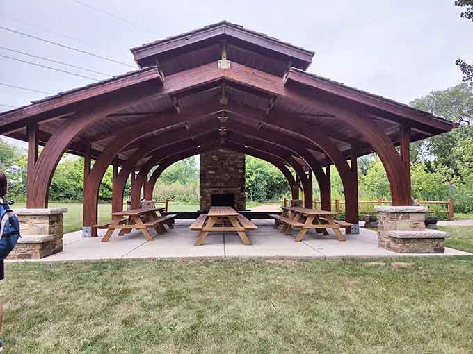This pavilion screams "family reunion headquarters" with enough picnic tables to seat your entire extended family tree.