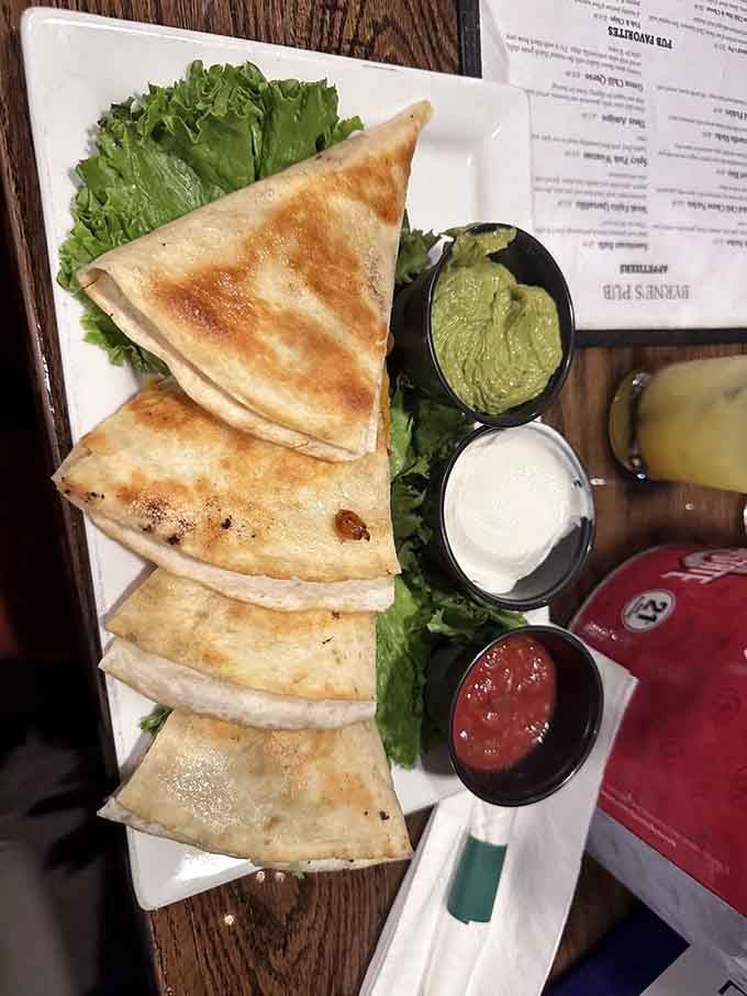 Golden, crispy quesadilla triangles lined up like edible soldiers, ready to march straight into your happy place.