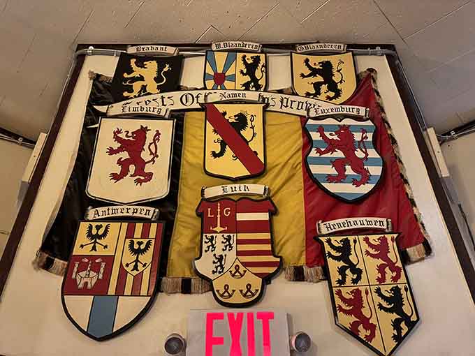 These provincial shields aren't just decoration, they're a colorful history lesson you can admire while waiting for your mussels.