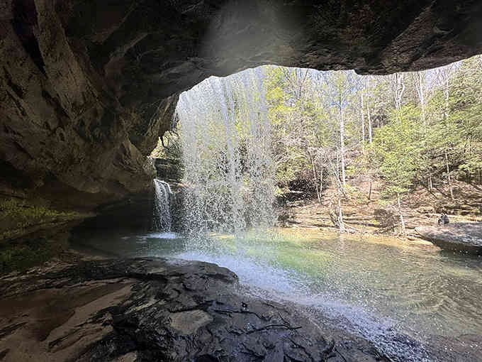 Standing beneath this natural rock shelter, you're looking at millions of years of geological artistry.