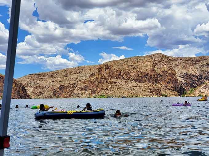 Families floating on colorful tubes beneath towering cliffs discover that paradise doesn't require a passport or plane ticket.