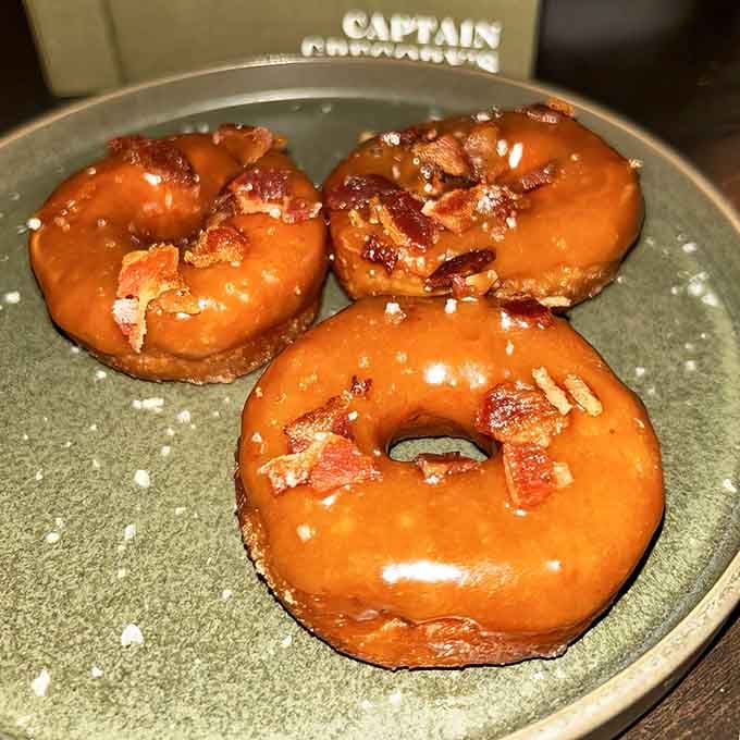 Maple bacon donuts that glisten like they've been kissed by breakfast angels with impeccable taste and timing.