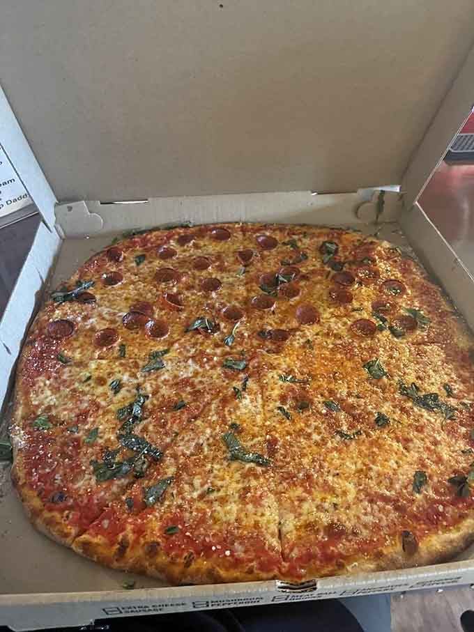 Golden cheese bubbling over crispy pepperoni with fresh basil is the kind of simple perfection that never gets old.