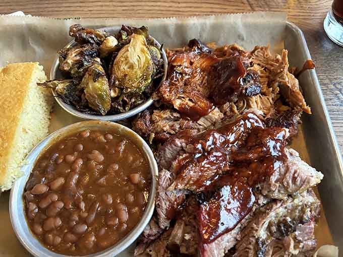 Behold the holy trinity: ribs, pulled pork, and Brussels sprouts that'll convert even the veggie skeptics.