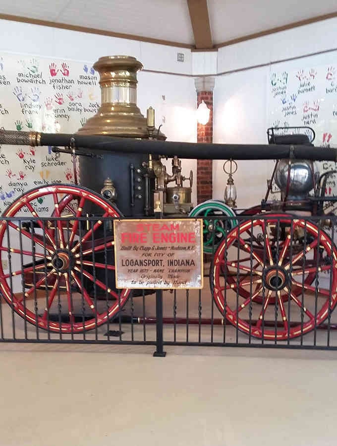 A vintage steam fire engine stands guard, reminding visitors that Logansport treasures its history beyond the carousel.