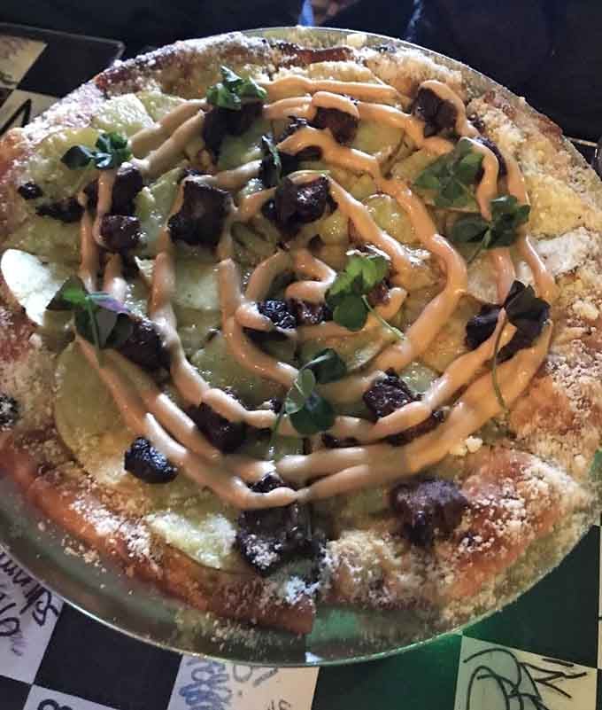 When pizza gets creative with unexpected toppings and drizzles, you know someone's having fun in that kitchen back there.