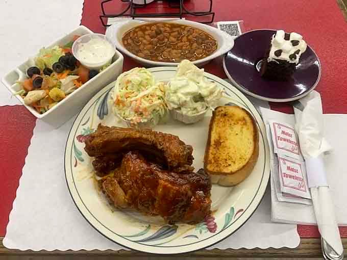 This spread of ribs, beans, coleslaw, and garlic bread could feed a lumberjack or three very happy people.
