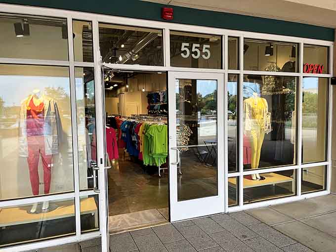 Bright athletic wear beckons from behind glass doors, promising comfort and style for your active lifestyle.