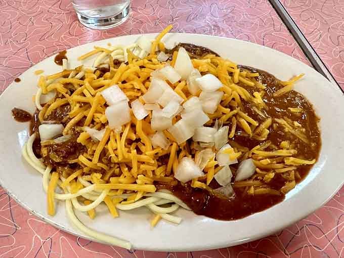 Spaghetti meets chili in a glorious union topped with cheese and onions that'll make you a believer.