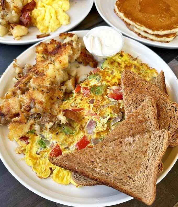 Behold the omelet that launched a thousand return visits, golden and fluffy with generous fillings throughout.