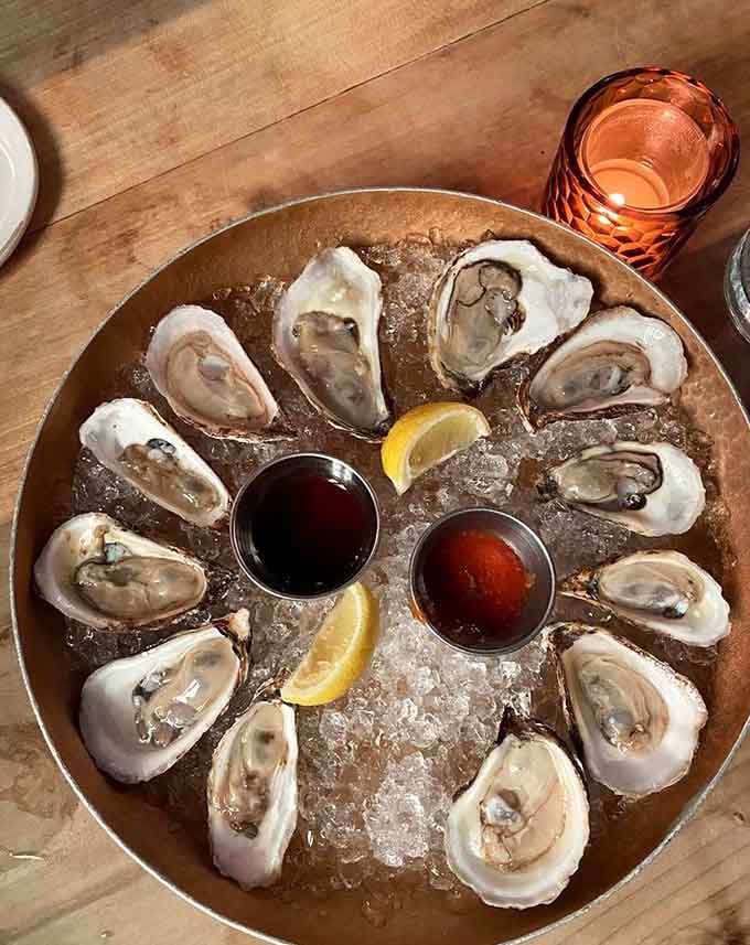 Fresh oysters on ice with mignonette and cocktail sauce, because sometimes the simplest pleasures are the most heavenly.