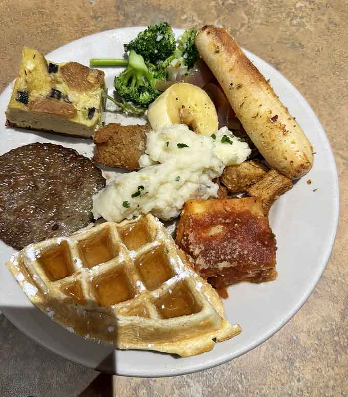 This plate has waffles, garlic bread, and broccoli coexisting peacefully like some beautiful culinary United Nations.