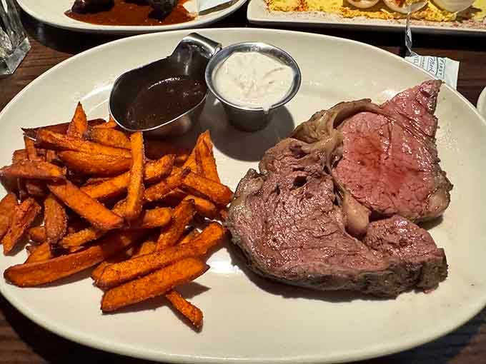 Prime rib with sweet potato fries proves that sometimes the classics just need a colorful sidekick.