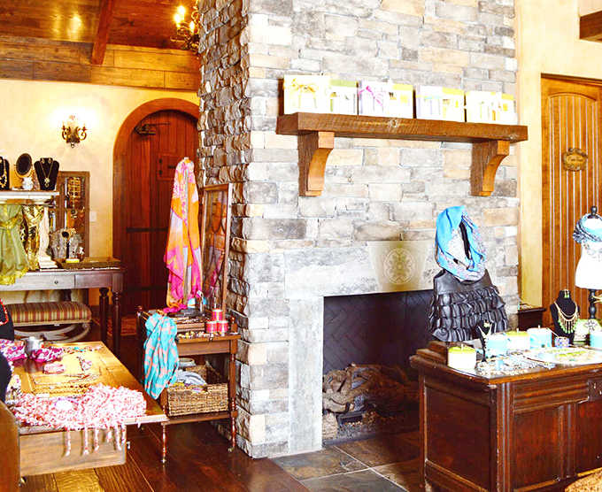 The stone fireplace and rustic beams create an atmosphere that whispers "you deserve this pampering session."