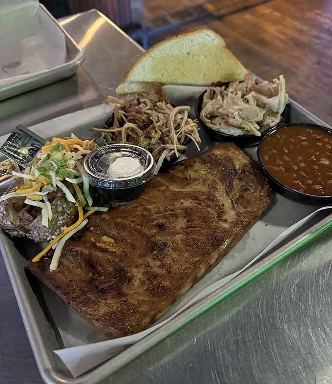 Ribs, pulled pork, brisket, beans, and slaw on one tray &ndash; it's like someone read your mind and made it delicious.