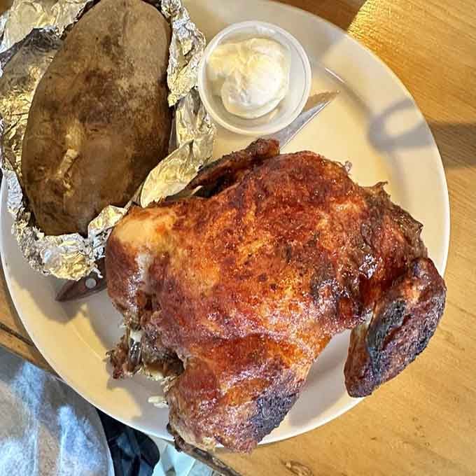 That's an entire roasted chicken on your plate, golden and crispy, proving that bigger really is better out here.