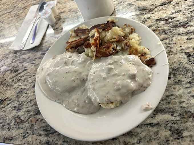 Biscuits smothered in creamy sausage gravy prove that some traditions deserve to last forever, calories be darned.