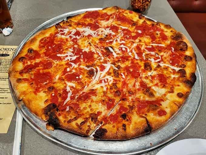 Behold the classic tomato pie with its thin crust, tangy sauce, and those gorgeous charred spots.