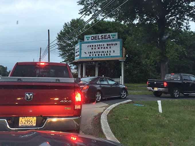 The anticipation starts at the entrance, where brake lights glow like opening credits for your evening adventure.