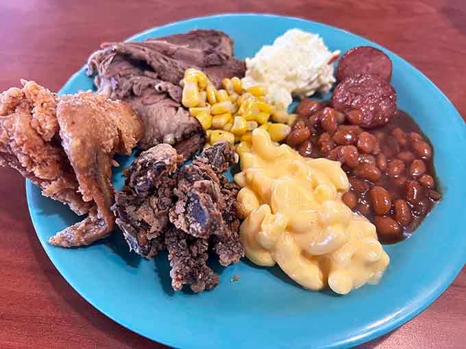 This plate tells a story: fried chicken, roast beef, mac and cheese, and beans living in perfect harmony.