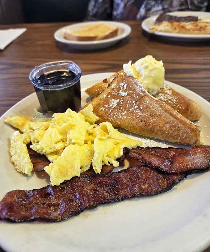 French toast, bacon, and scrambled eggs: the holy trinity of breakfast done absolutely right here.