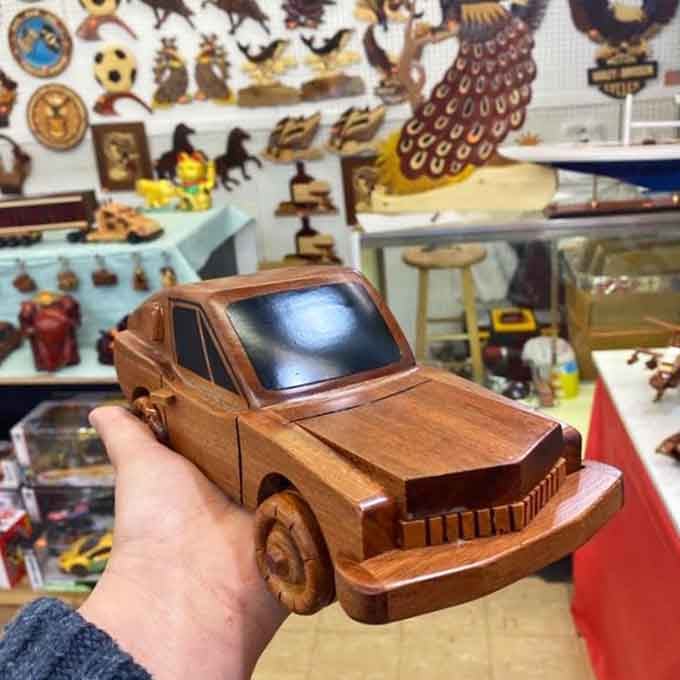 This handcrafted wooden car has more personality than most actual vehicles you'll see on the highway today.