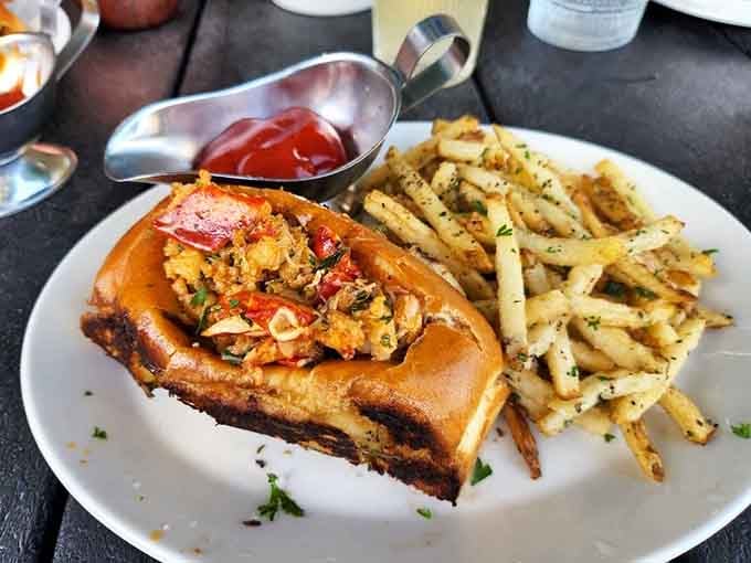 That lobster roll is stuffed so generously, it's practically overflowing with sweet, tender seafood and zero regrets.