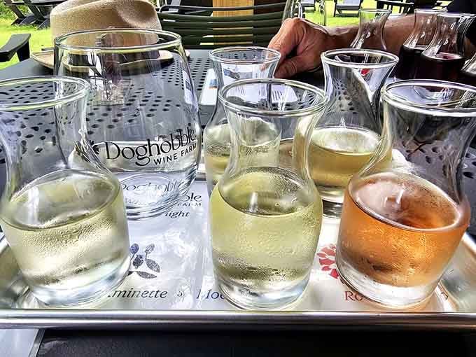 A white wine flight catches the sunlight like liquid gold, ready to reveal its secrets one sip at a time.