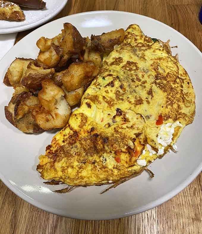 This omelet could feed a small village or one very determined breakfast enthusiast with excellent priorities.