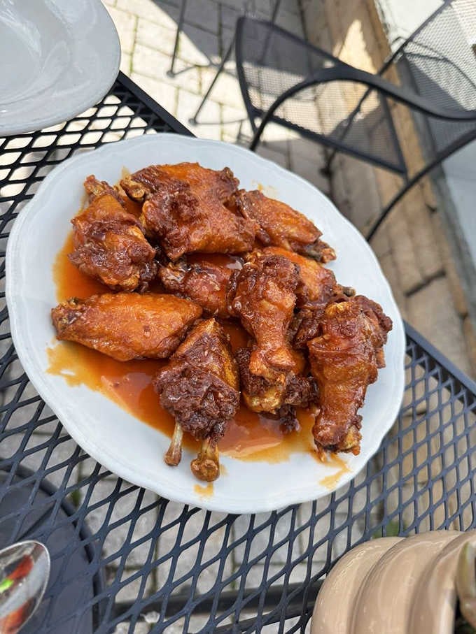Golden, crispy, and glistening with sauce, these wings are worth crossing state lines for, ghosts or no ghosts.
