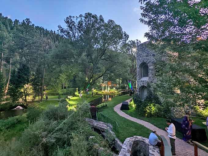 Evening lights transform the castle grounds into something straight out of a fantasy novel set in the mountains.