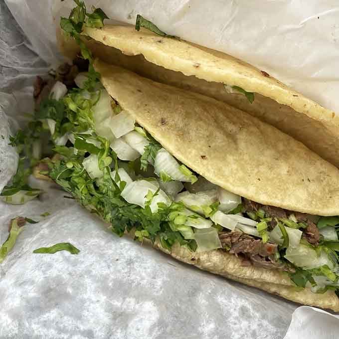 The asada taco: charred perfection on fresh corn tortillas that'll ruin every other taco for you.