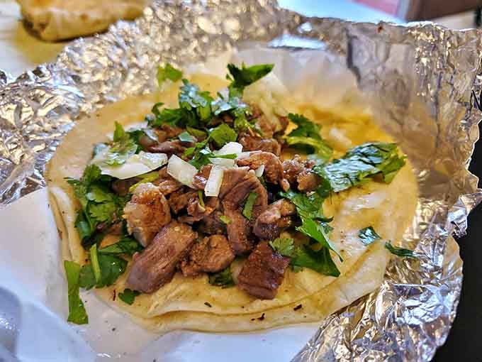 Carne asada piled high with cilantro and onions&mdash;this is what taco dreams are made of, folks.