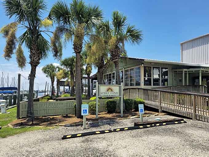 Sunset Pointe offers front-row seats to nature's nightly show, complete with palm trees and waterfront dining options.