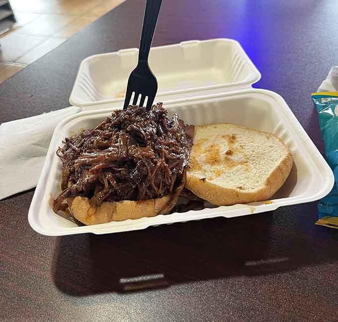 Beef brisket piled high on toasted bread, because sometimes the simplest presentations deliver the most spectacular flavors.