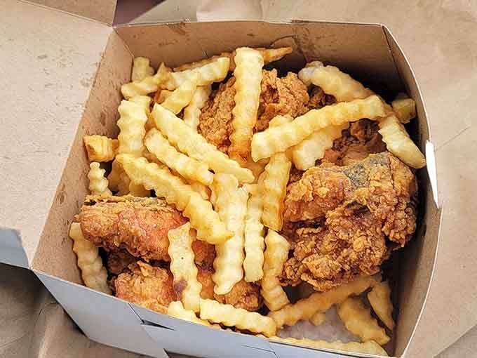 Golden, crispy chicken piled high with crinkle-cut fries is the kind of sight that makes your heart sing.