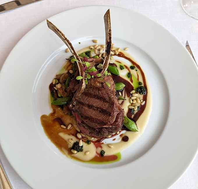 Colorado lamb so tender it practically melts before your fork arrives, plated like edible art.