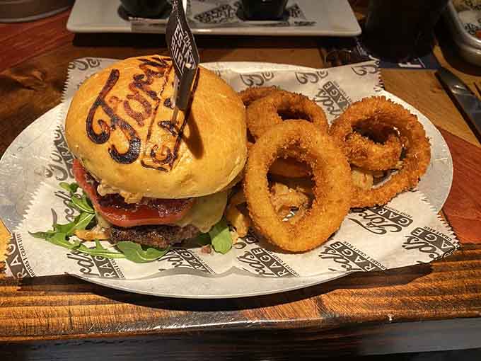 That burger comes with onion rings so perfectly golden, they deserve their own automotive hall of fame induction.