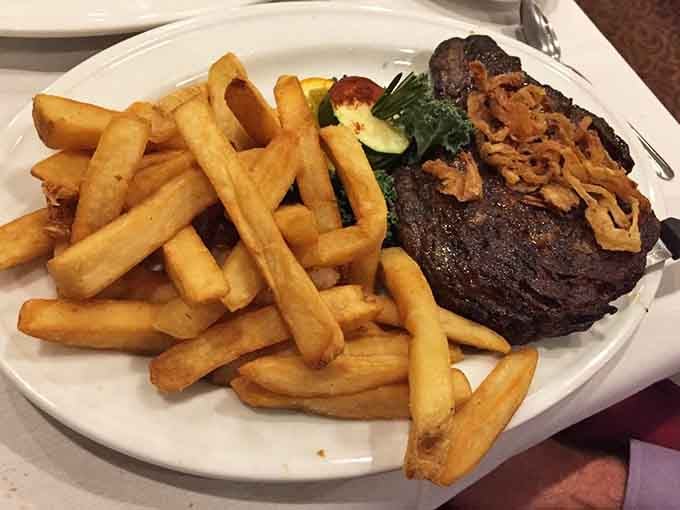 Behold the steak that launched a thousand doggy bags, perfectly charred and accompanied by golden fries.