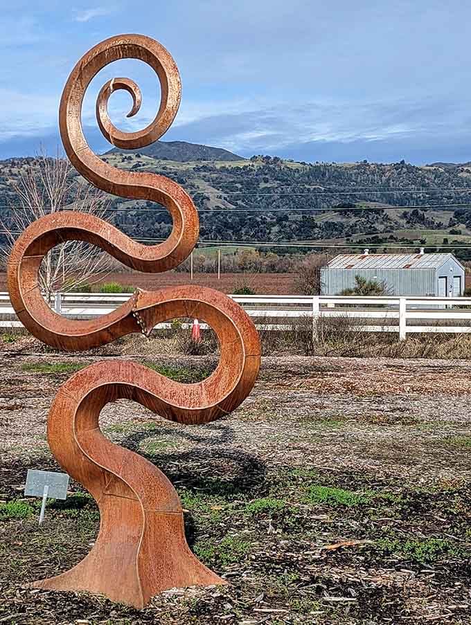 That rusty ribbon twists skyward like a corkscrew designed by Salvador Dal&iacute; after one too many Zinfandels.