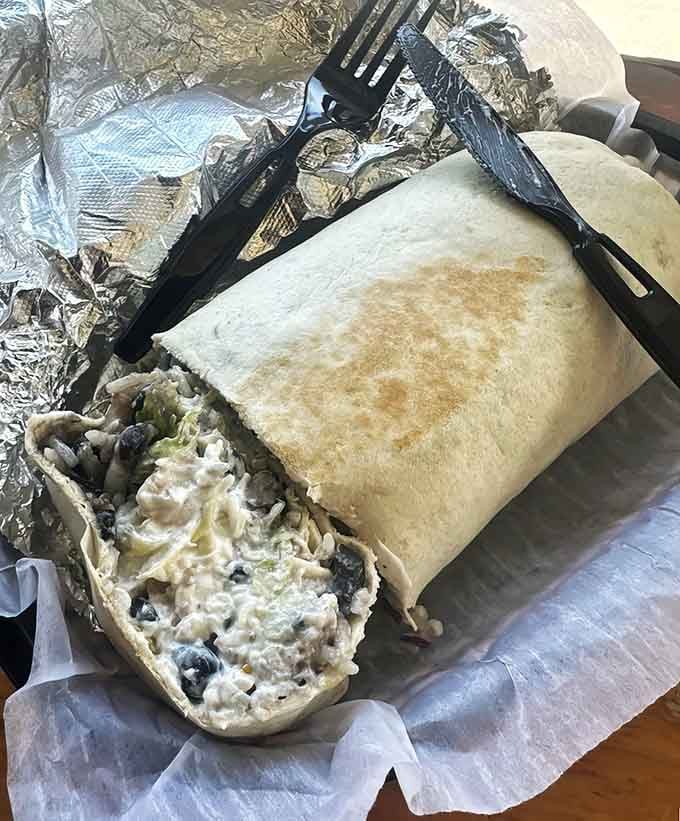 Behold: a burrito so generously stuffed it's practically auditioning for its own zip code.