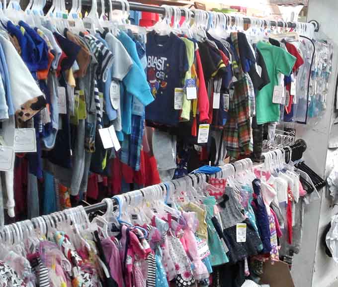 Kids' clothing racks bursting with colors and patterns that won't break grandma's gift-giving budget.