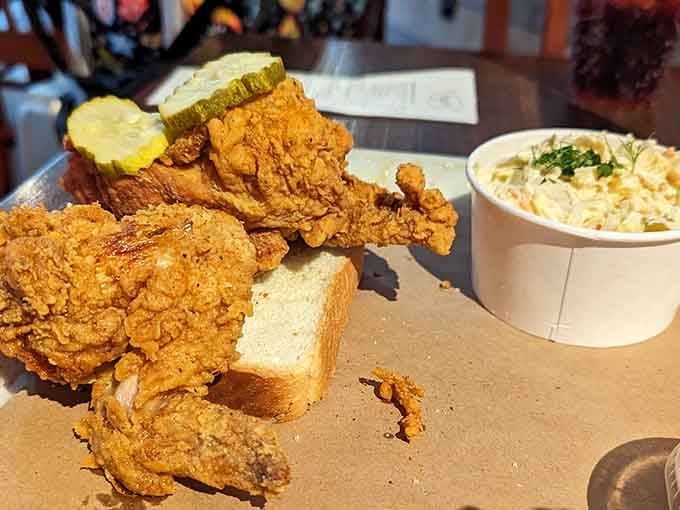 Golden, crispy, and glistening with promise, this fried chicken comes with pickles and all the Southern comfort you need.