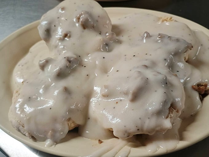 Biscuits drowning in peppery cream gravy, the kind of breakfast that makes mornings worth waking up for.