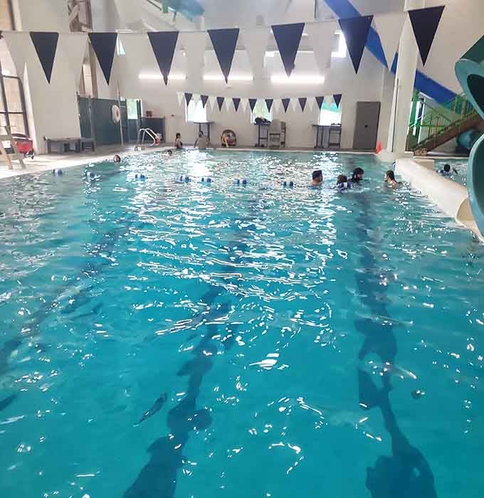 The lap pool offers serious swimmers their zone while families splash nearby, proving everyone gets their perfect water experience.