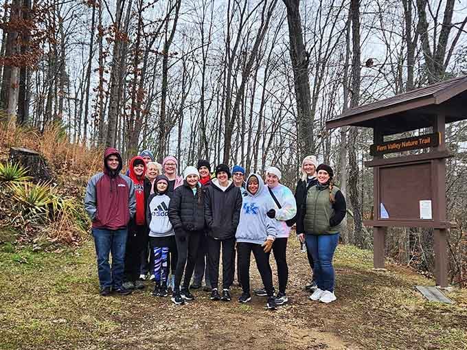 Happy hikers gathered at the trailhead, proving getting outside beats scrolling through vacation photos of other people.